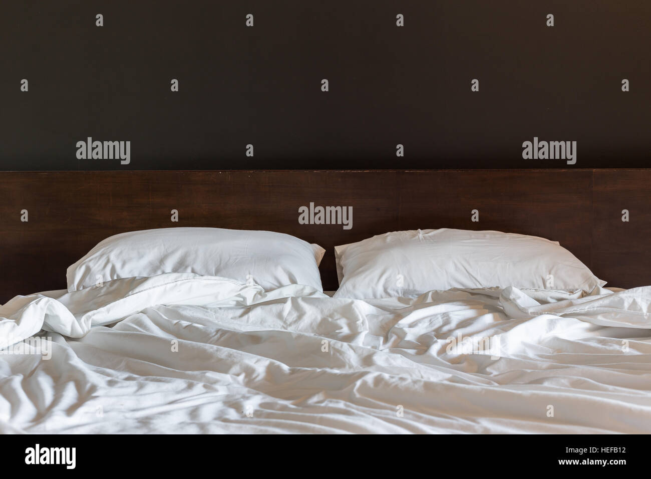 Close up white bedding sheets and pillow, Messy bed concept Stock Photo ...