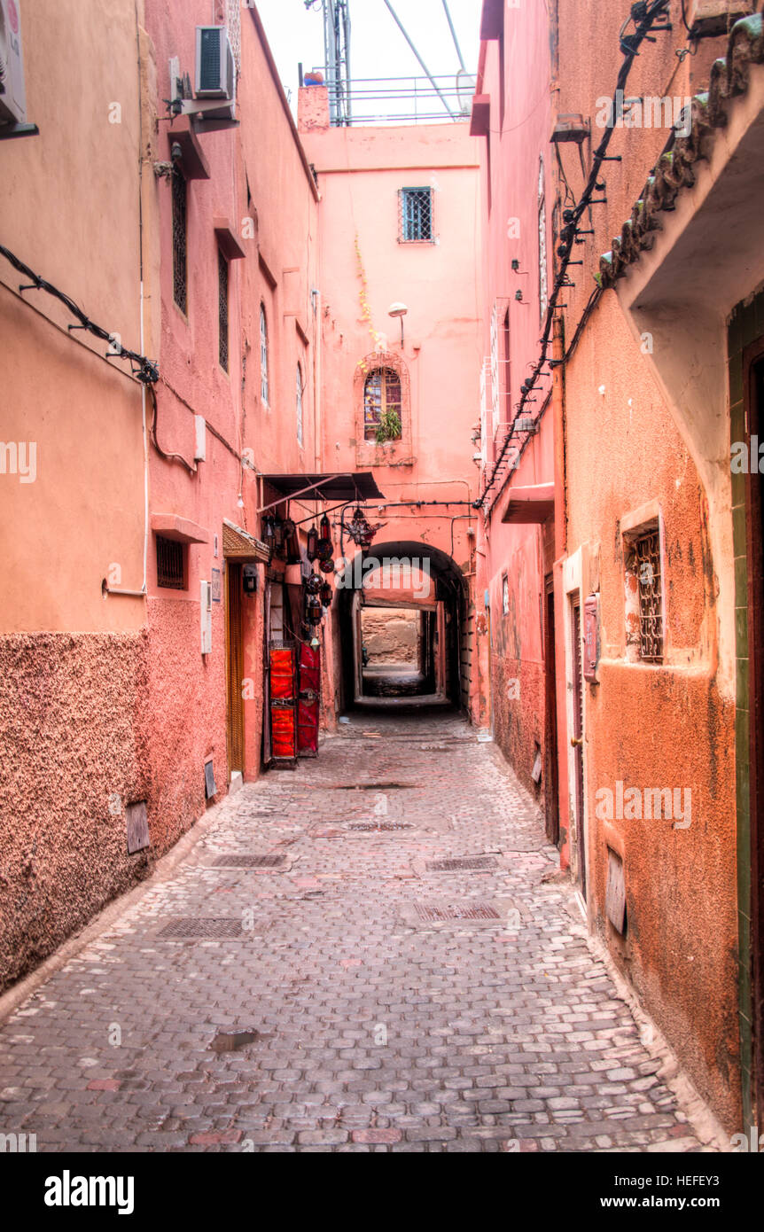 A typical street with red buildings in the center of Marrakesh in ...