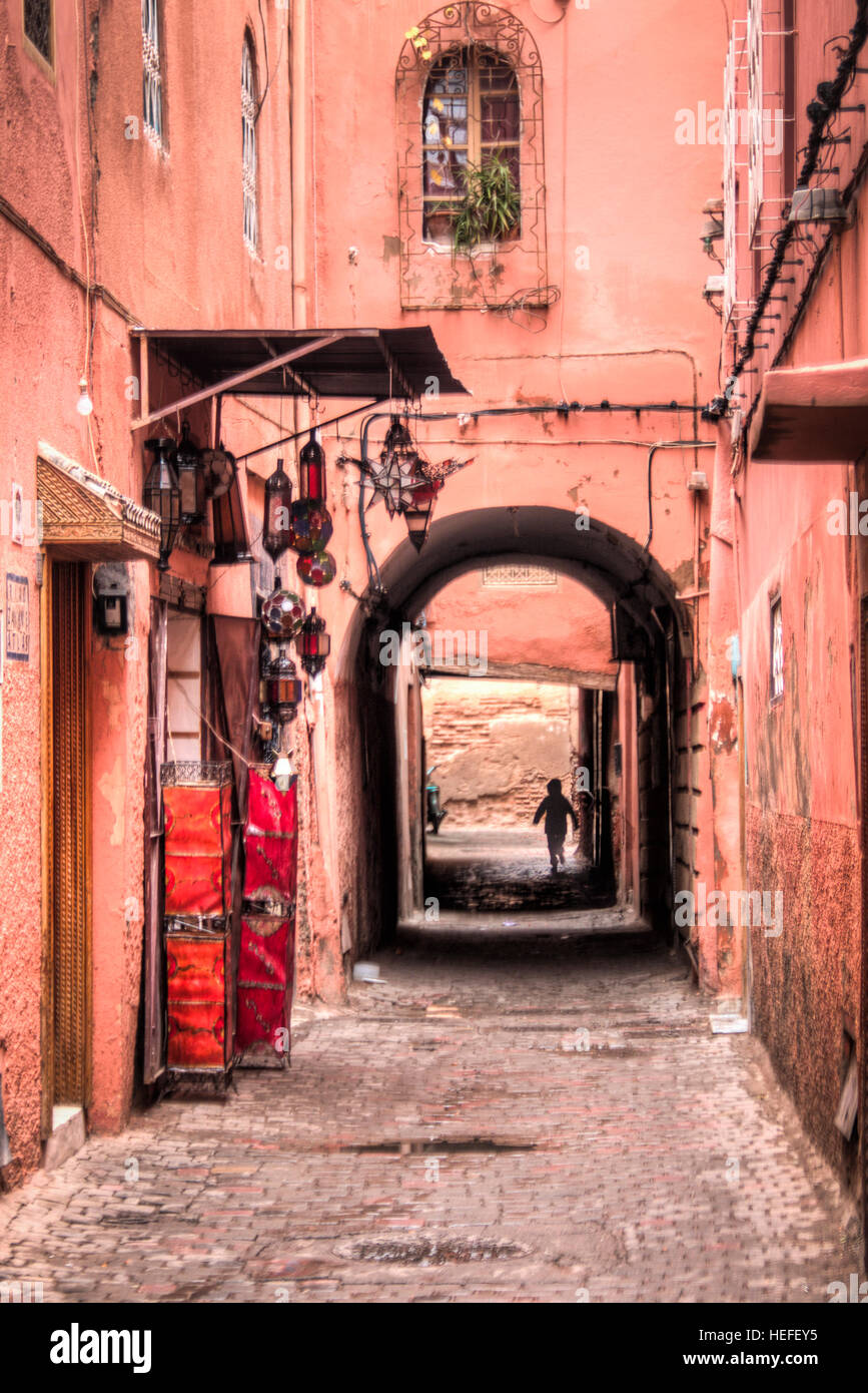 A typical street with red buildings in the center of Marrakesh in ...