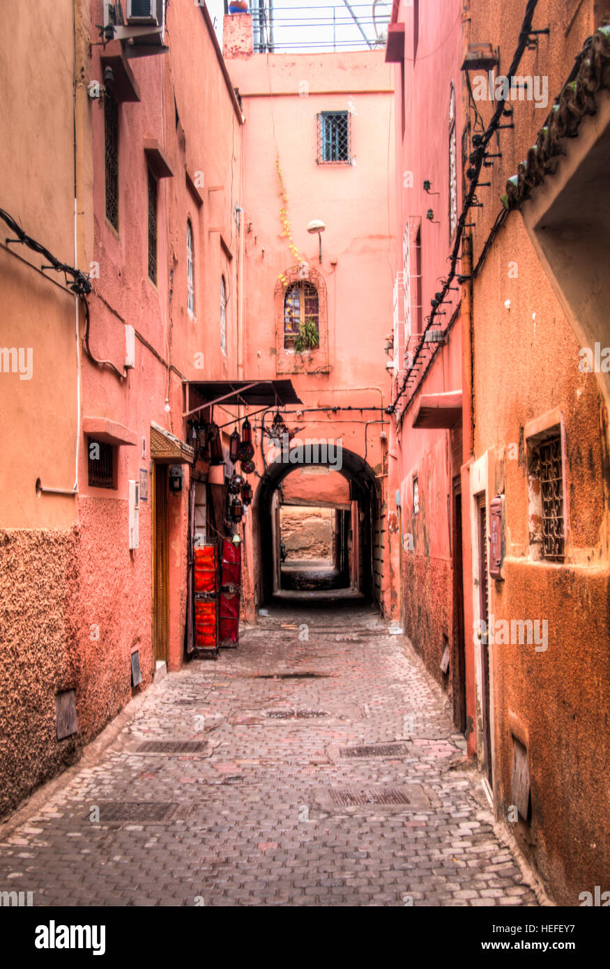 A typical street with red buildings in the center of Marrakesh in ...