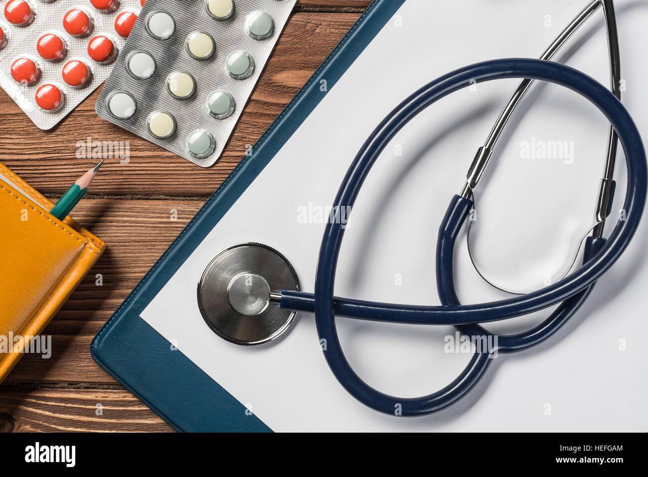 Desk of doctor with medicine things Stock Photo - Alamy