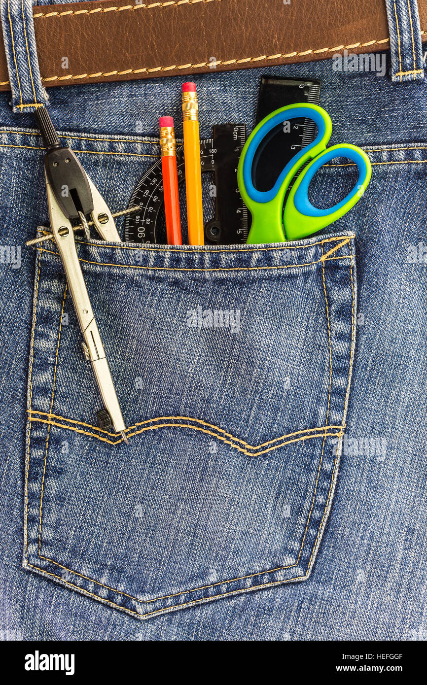 set of school tools in a back pocket of a blue denim jeans Stock Photo ...