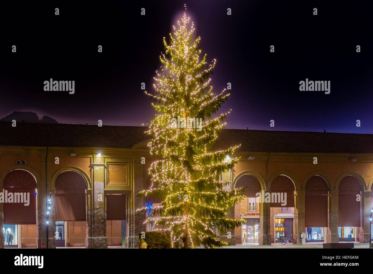 lights of christmas tree in old portico at night Stock Photo - Alamy