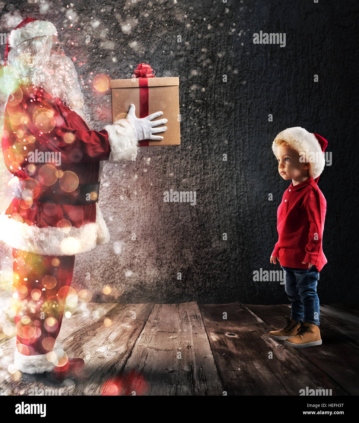 Santa Claus deliver a gift to a child Stock Photo - Alamy