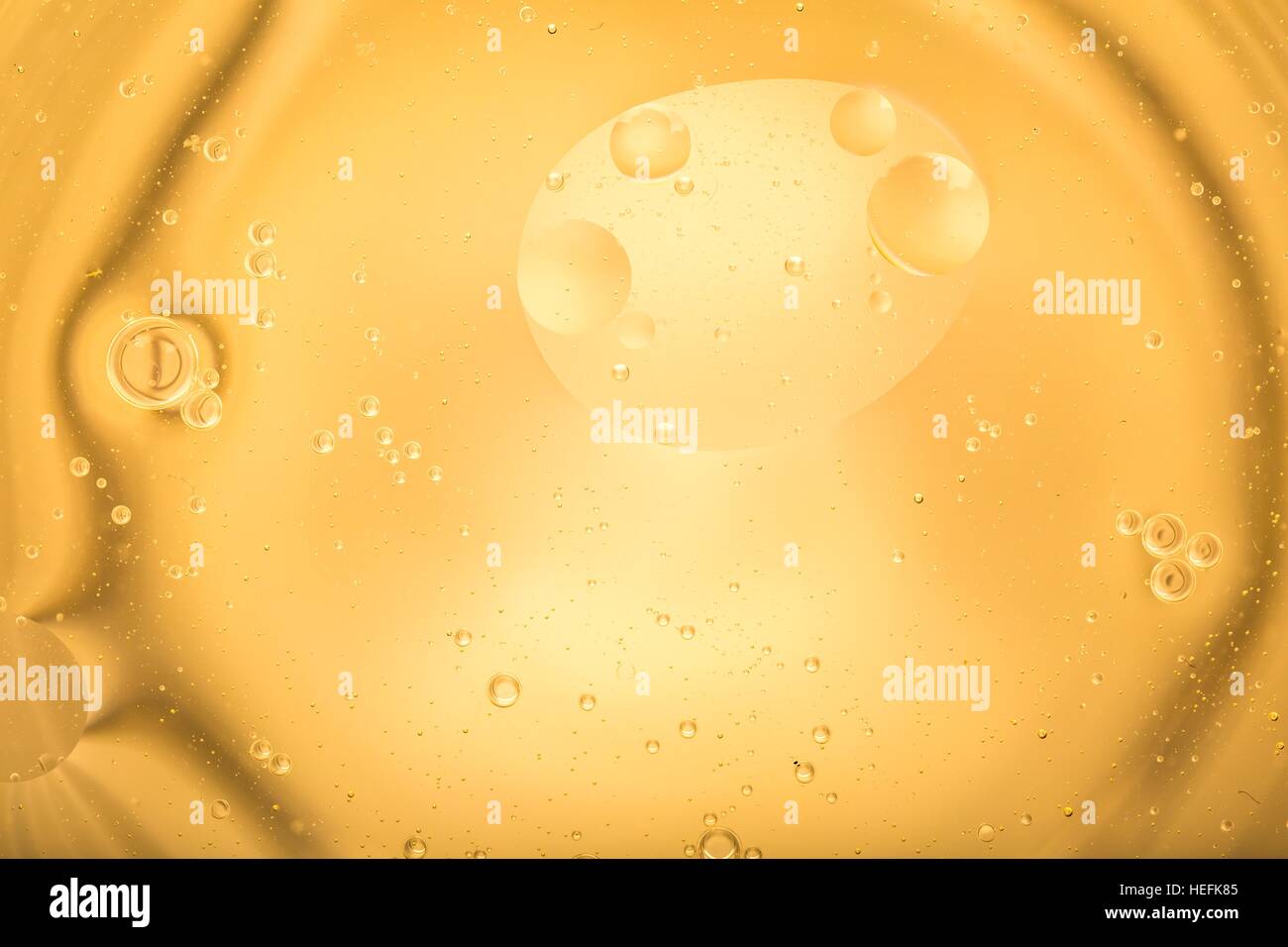 Oil droplets on water surface. Abstract background with shallow depth ...