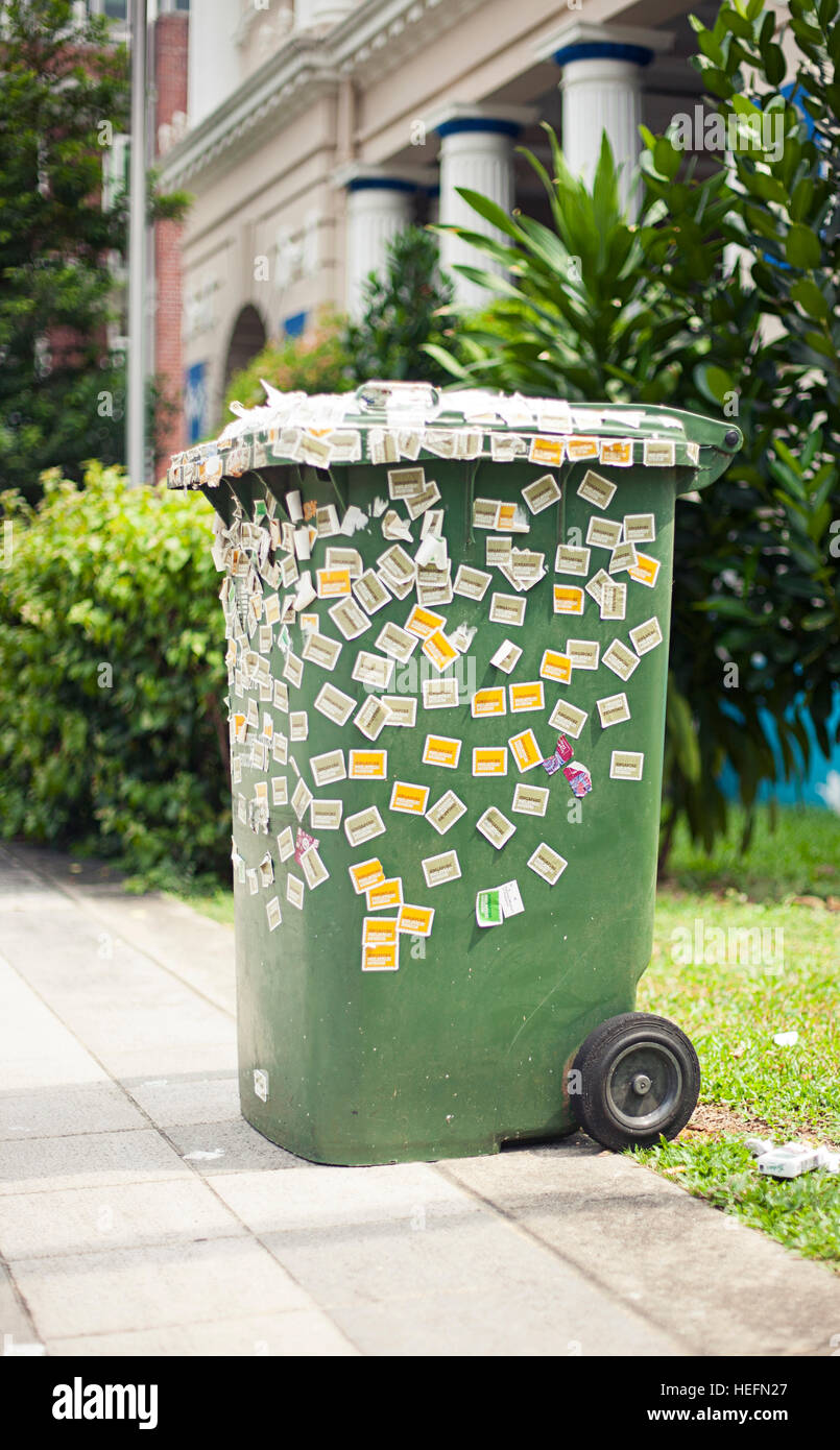 Large green trash box with stickers Stock Photo - Alamy