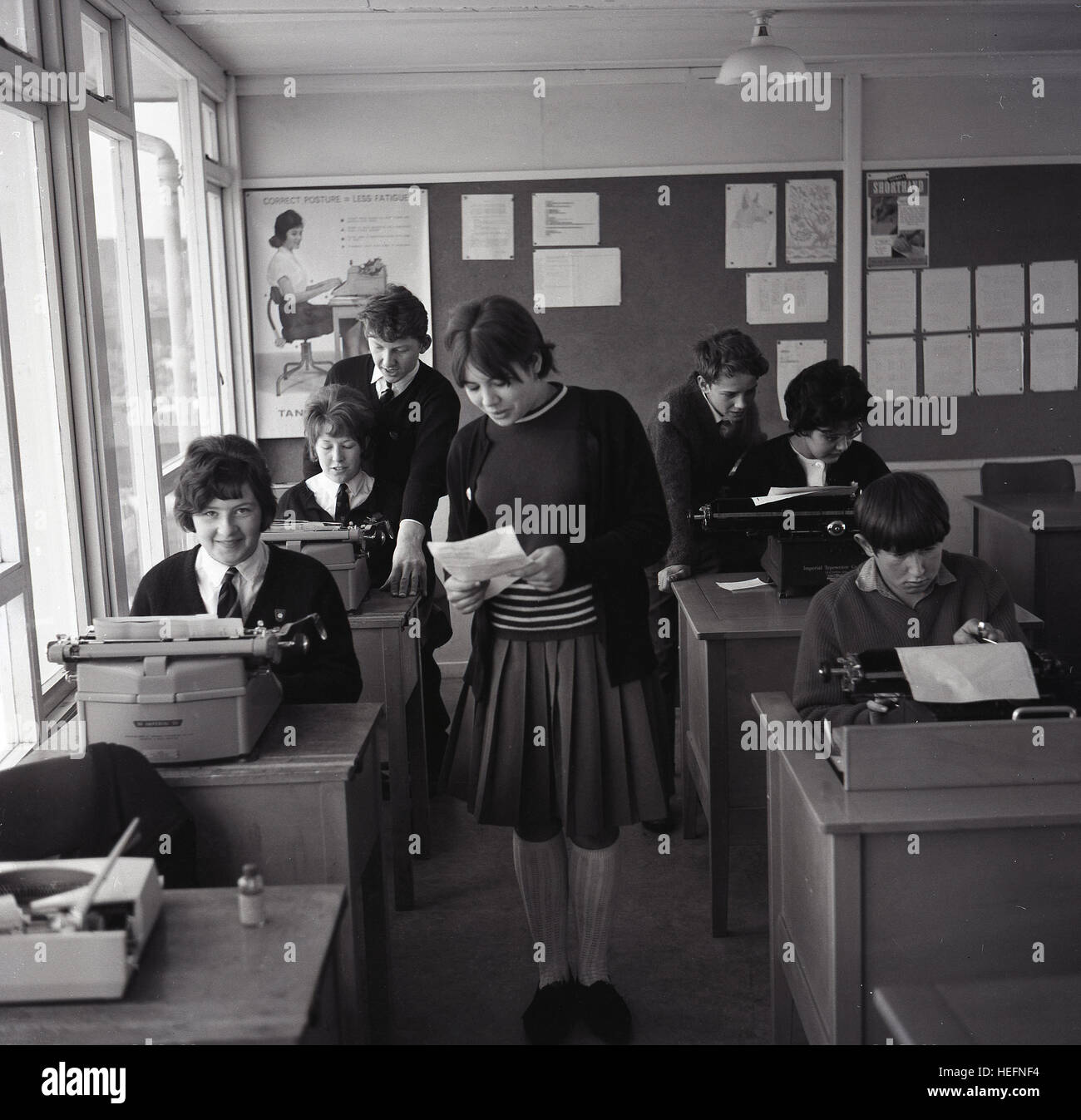 1960s, historical, young students learning office based skills such as ...
