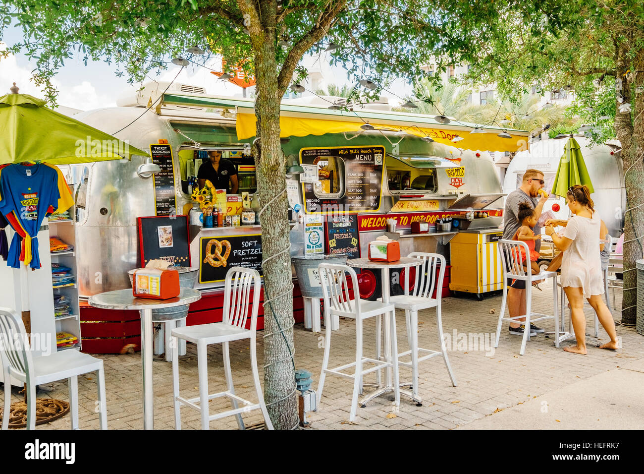 Food truck, with a family eating, at the beach resort town of Seaside ...
