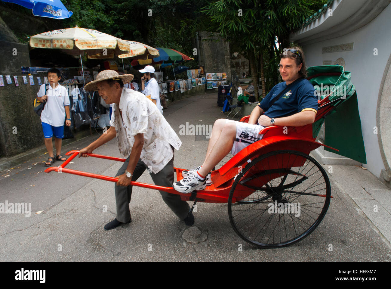 A tourists taken pictures inside of a old Rickshaw, Hong Kong, China ...