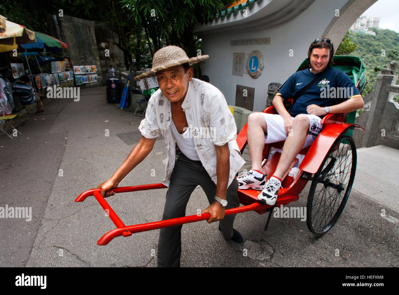 A tourists taken pictures inside of a old Rickshaw, Hong Kong, China ...