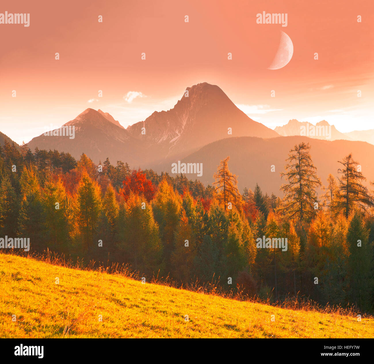 Mountain world, evening mood with moon Stock Photo - Alamy