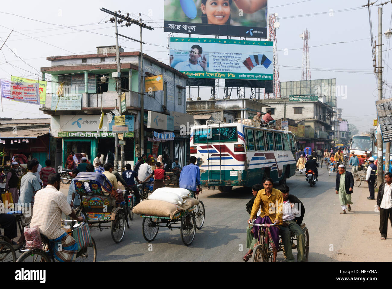Jessore: Street scene, bus, bicycle rickshaw, Khulna Division ...