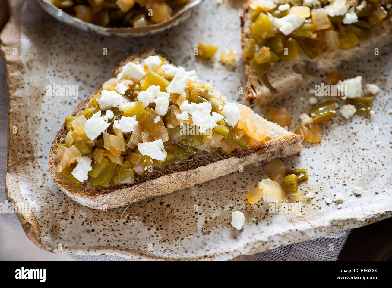Healthy homemade green pepper toast with feta. Bread with Hatch chiles ...