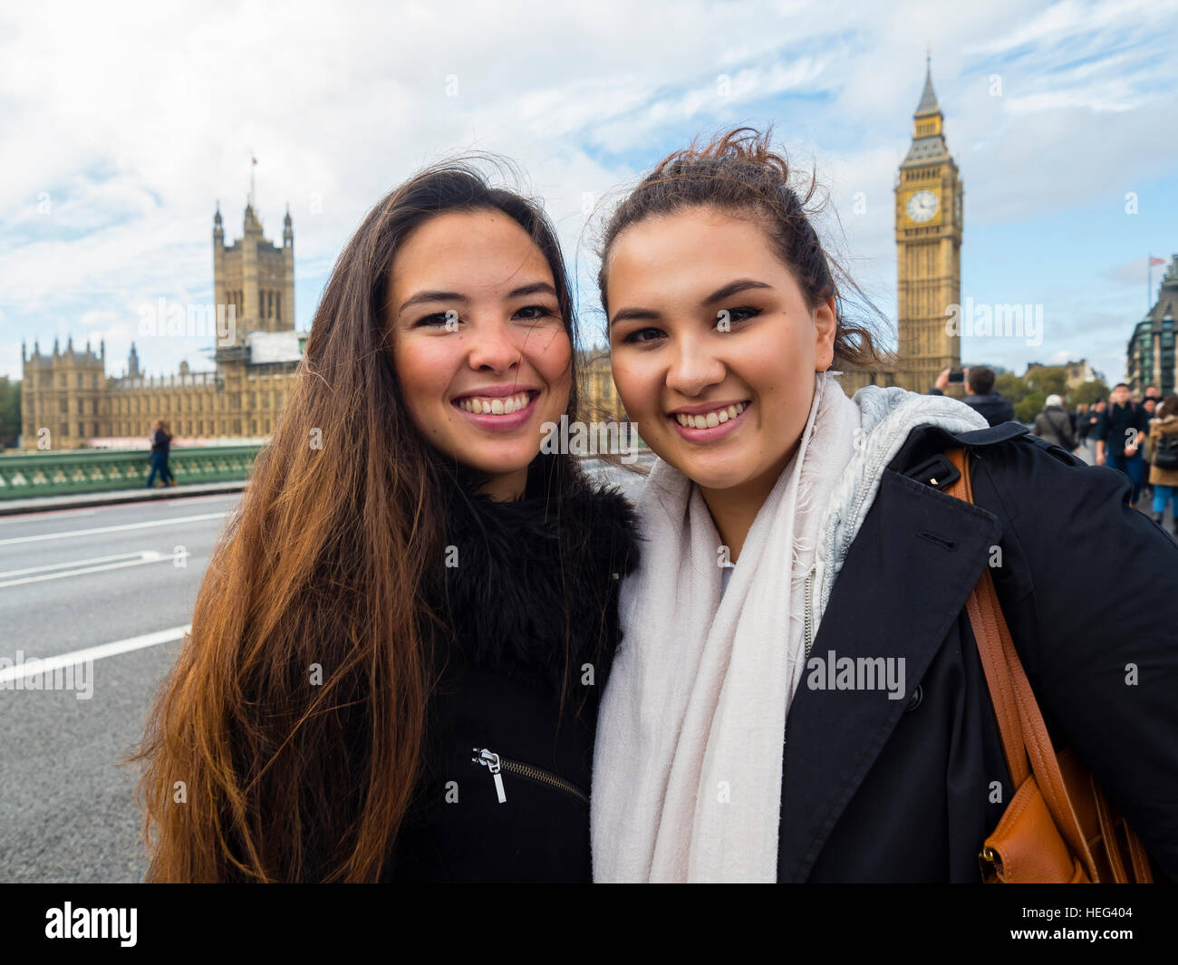 Two girls in front of Big Ben, City of Westminster, London, England ...