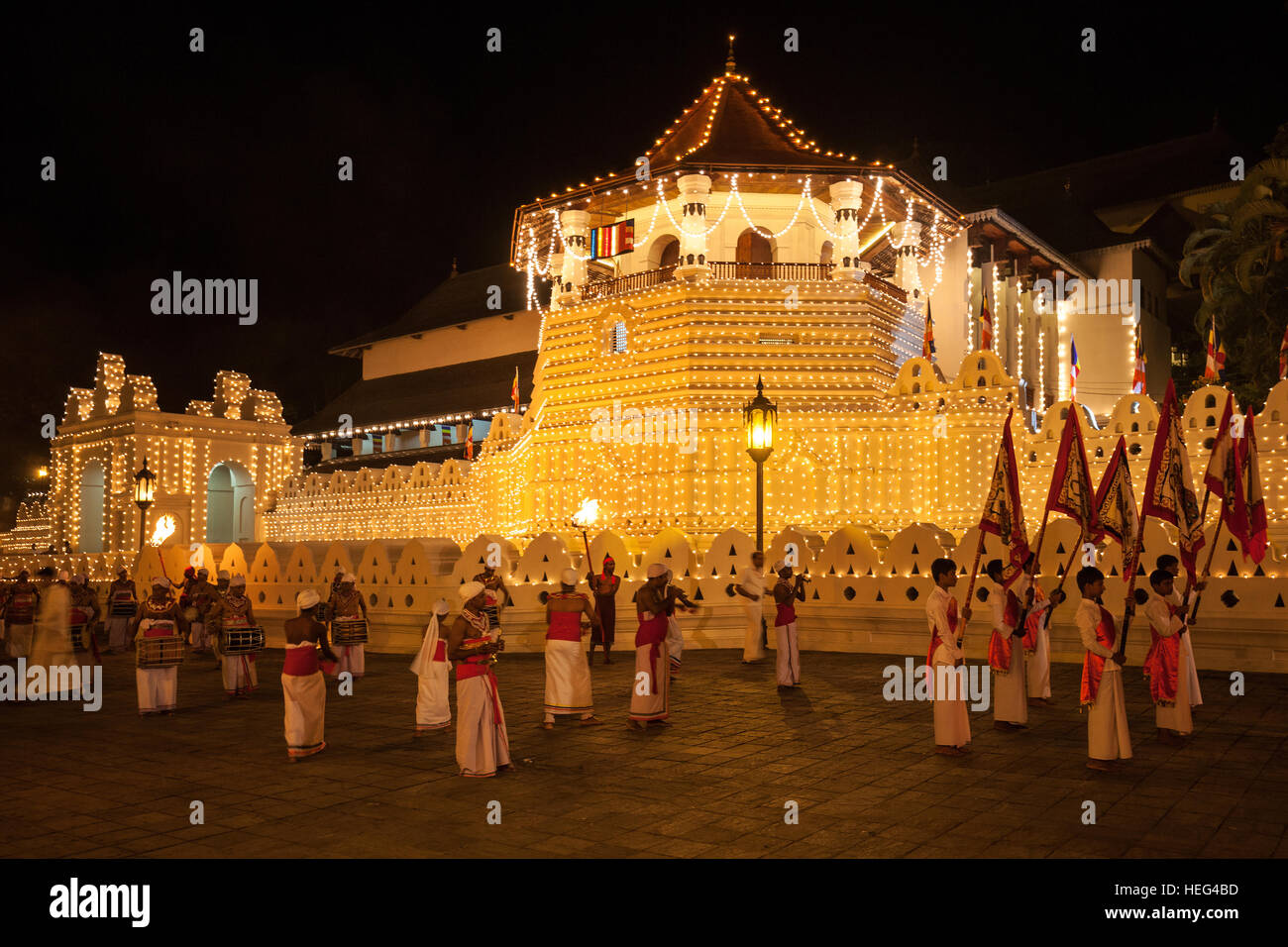 Flag bearers and drummers in traditional costumes, Esala Perahera ...