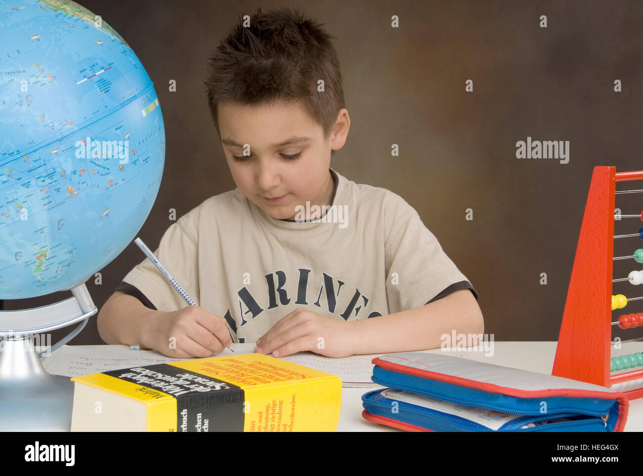 Schoolboy, seven-year-old boy doing his homework Stock Photo - Alamy