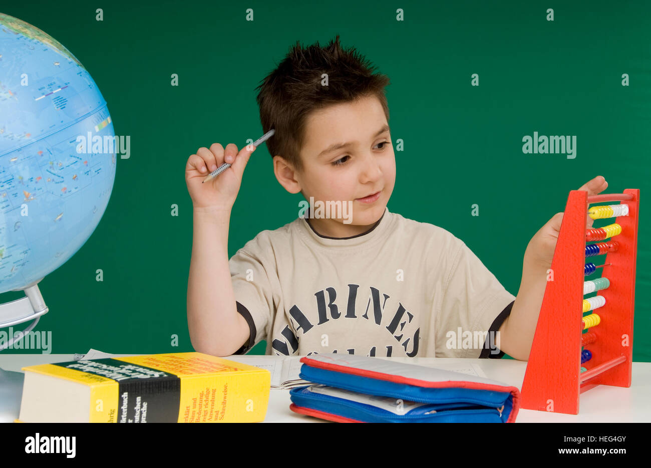 Schoolboy, seven-year-old boy doing his homework Stock Photo - Alamy