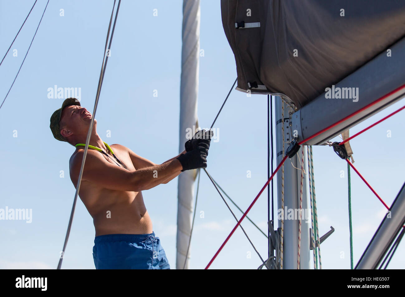 Man on the sailing yacht boat Stock Photo - Alamy