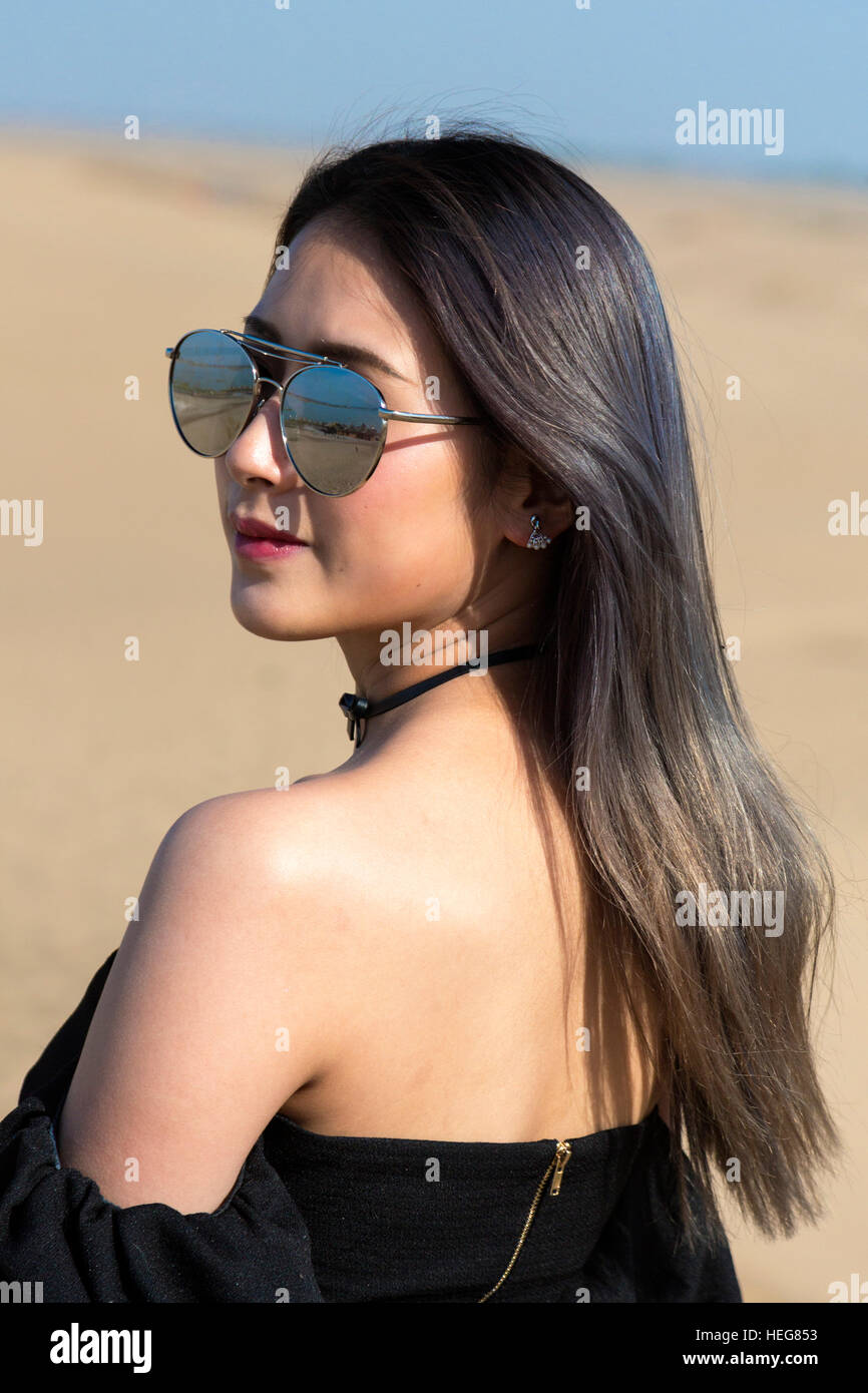 Chinese girl posing at Sand Lake, Shizuishan, Ningxia, China Stock ...