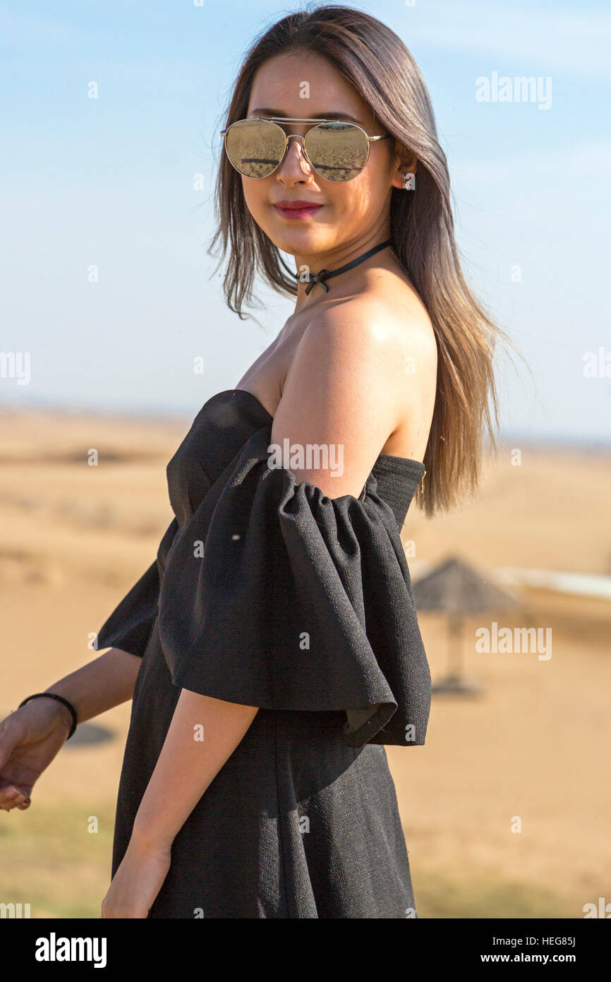 Chinese girl posing at Sand Lake, Shizuishan, Ningxia, China Stock ...