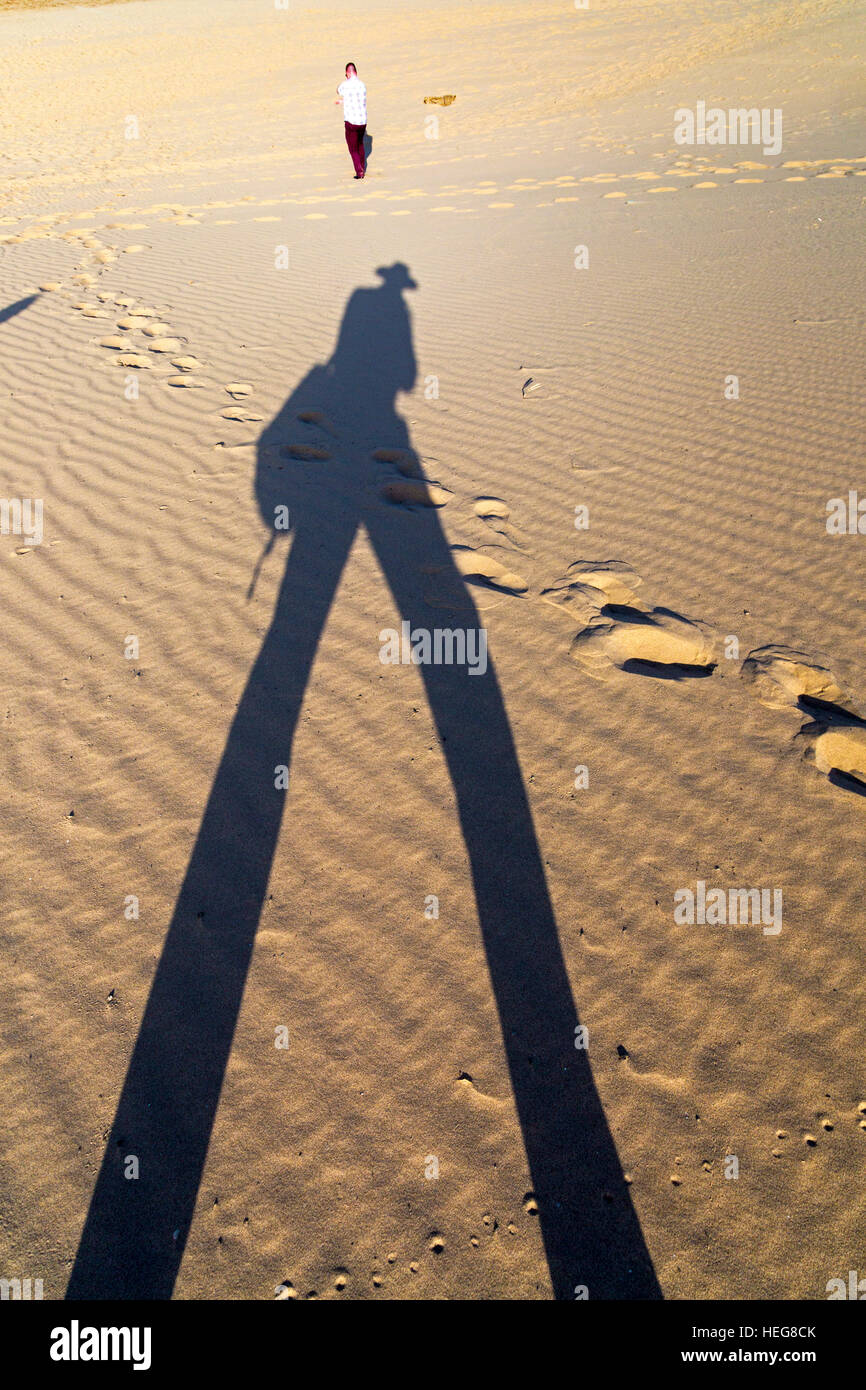 Tourist Casting A Shadow In The Desert At Sand Lake Shizuishan