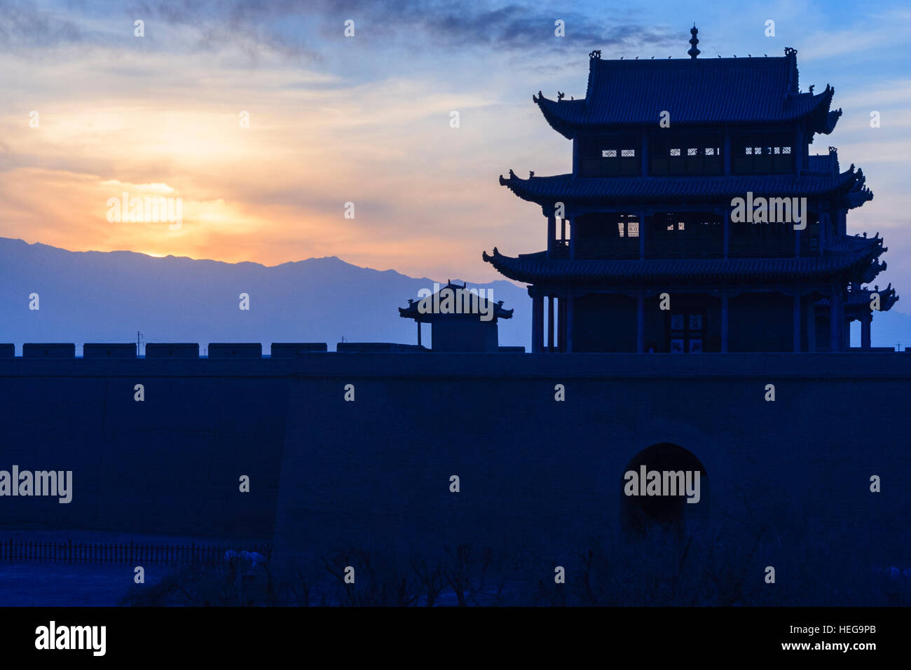 Jiayuguan fort at dusk at the western boundary of the Great Wall of ...