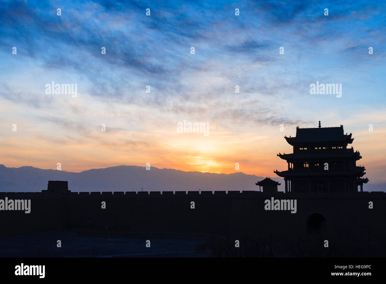 Jiayuguan fort at dusk at the western boundary of the Great Wall of ...