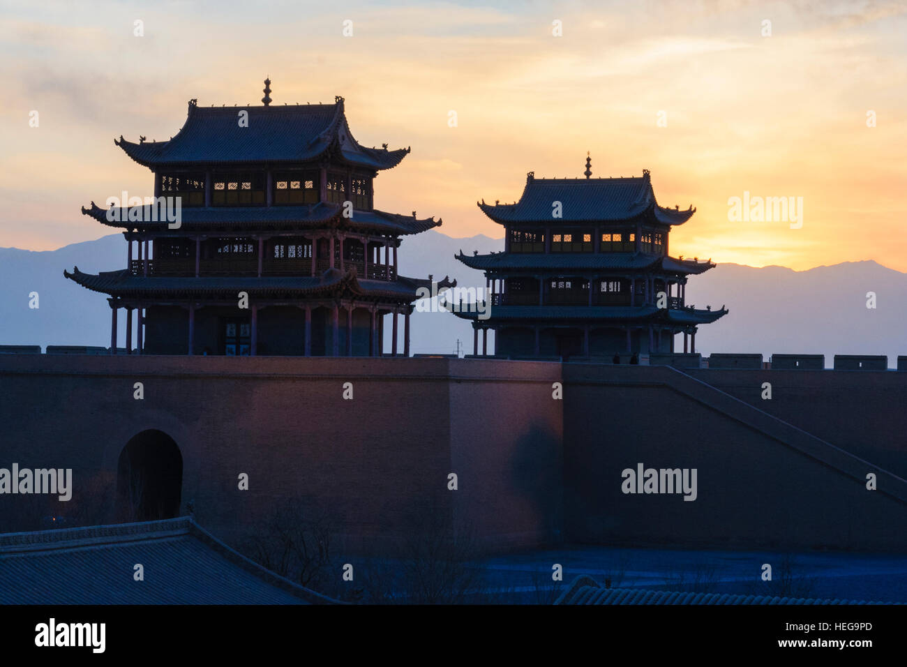 Jiayuguan fort at dusk at the western boundary of the Great Wall of ...