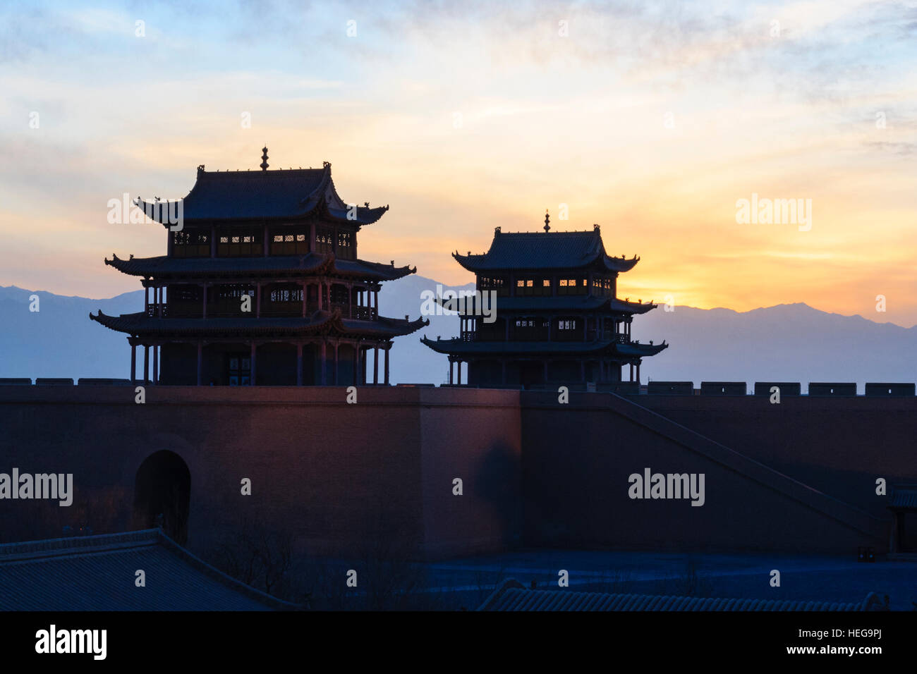 Jiayuguan fort at dusk at the western boundary of the Great Wall of ...