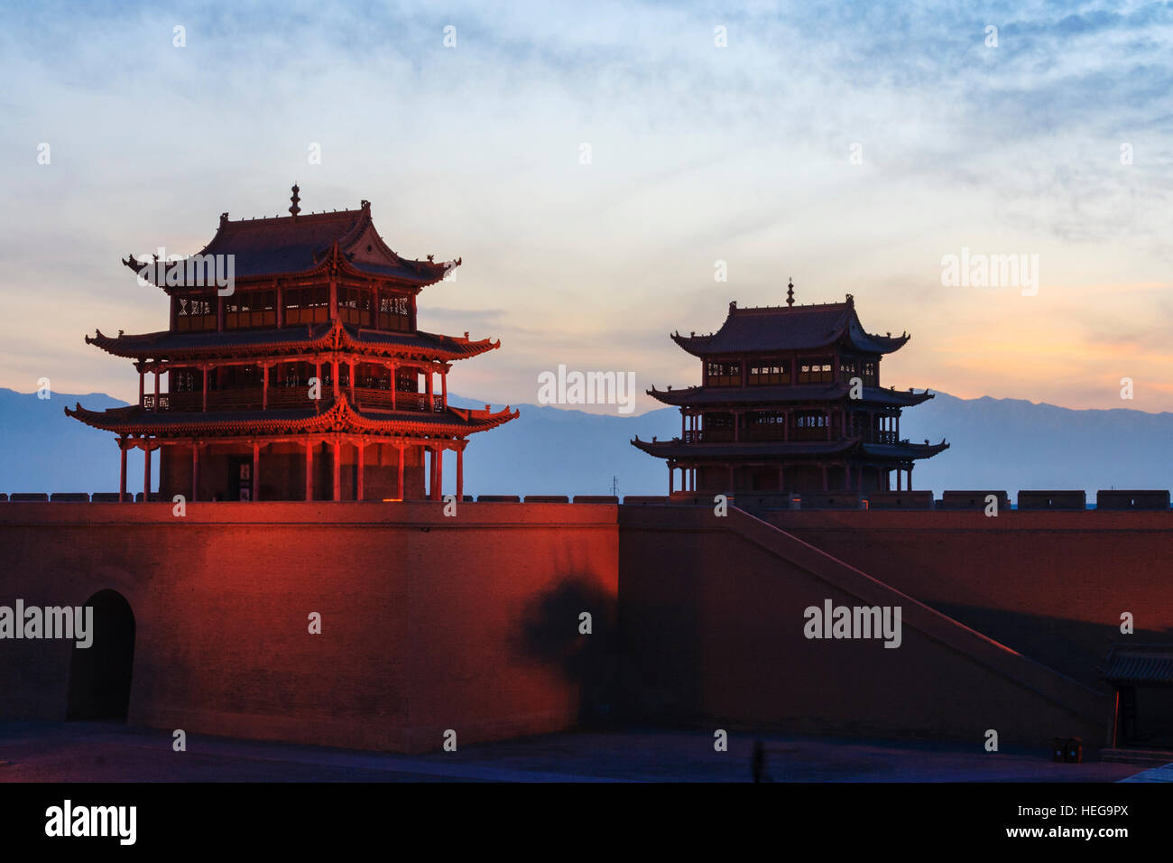 Jiayuguan fort at dusk at the western boundary of the Great Wall of ...