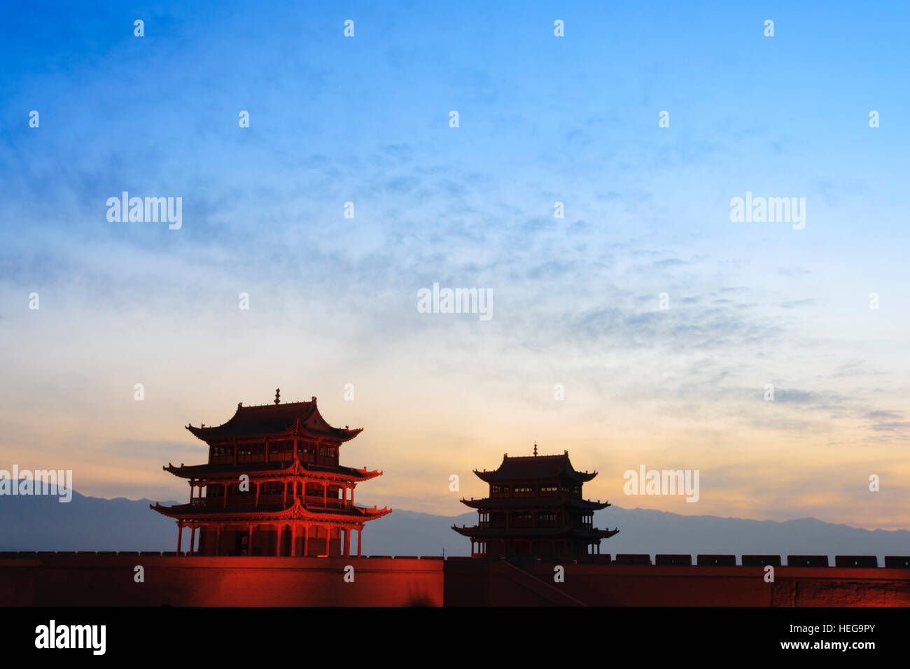 Jiayuguan fort at dusk at the western boundary of the Great Wall of ...