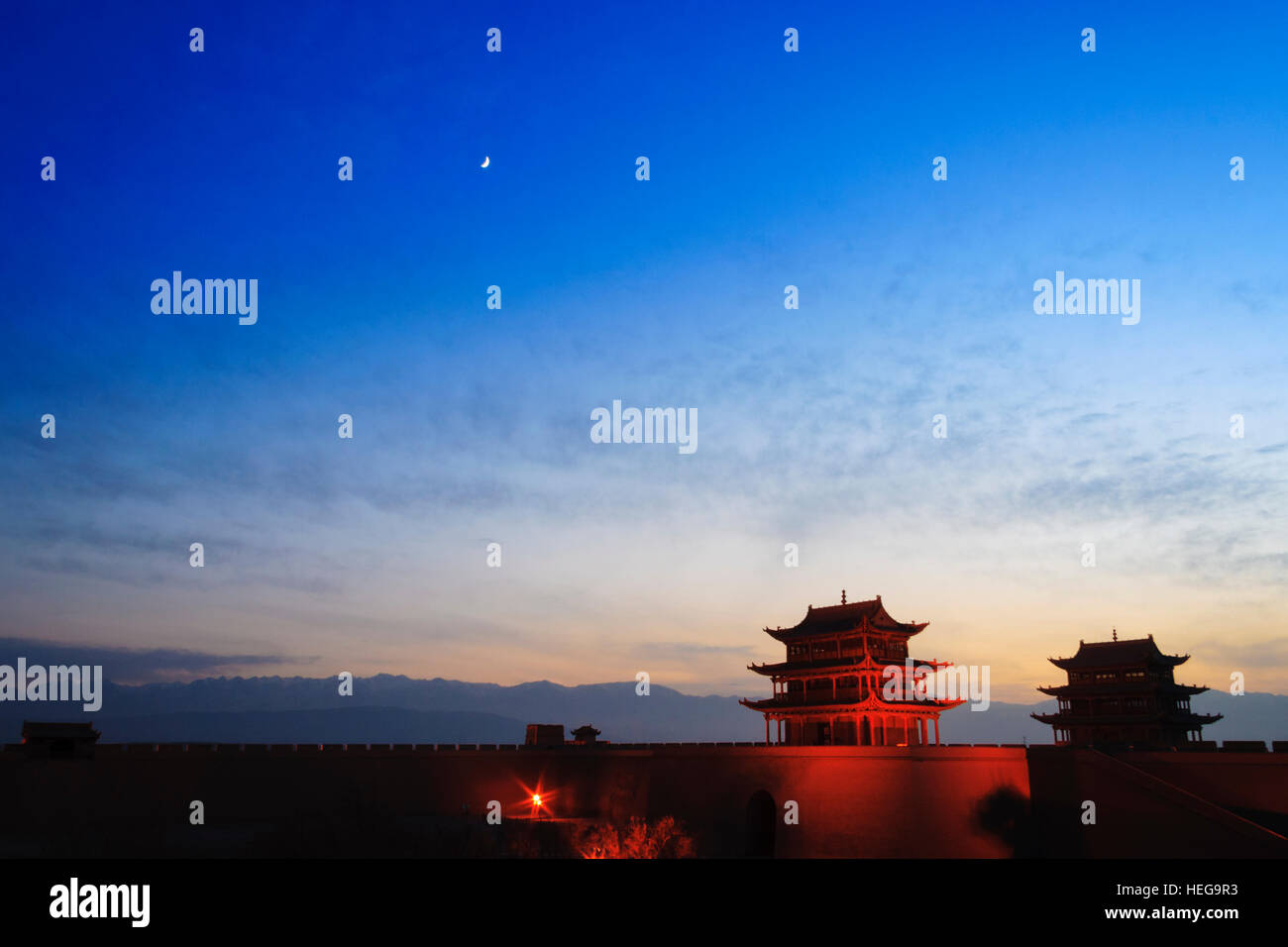 Jiayuguan fort at dusk at the western boundary of the Great Wall of ...