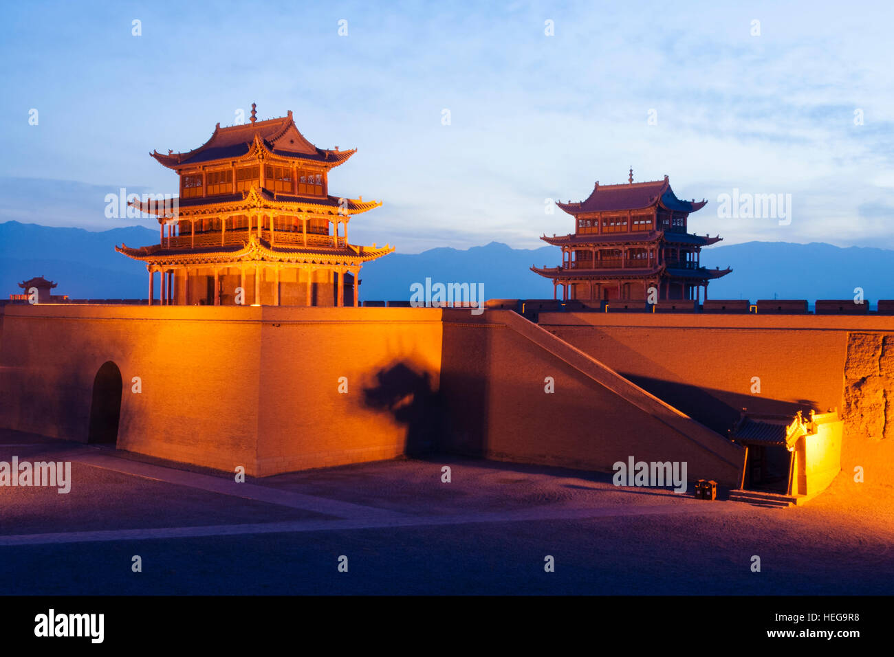 Jiayuguan fort illuminated at twilight at the western boundary of the ...