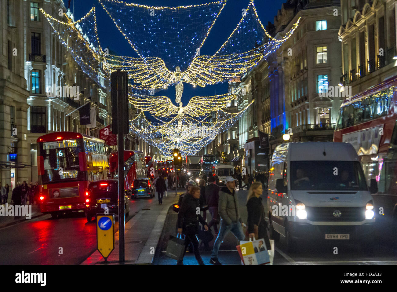Christmas shoppers walking along a busy Regent Street at Christmas in ...
