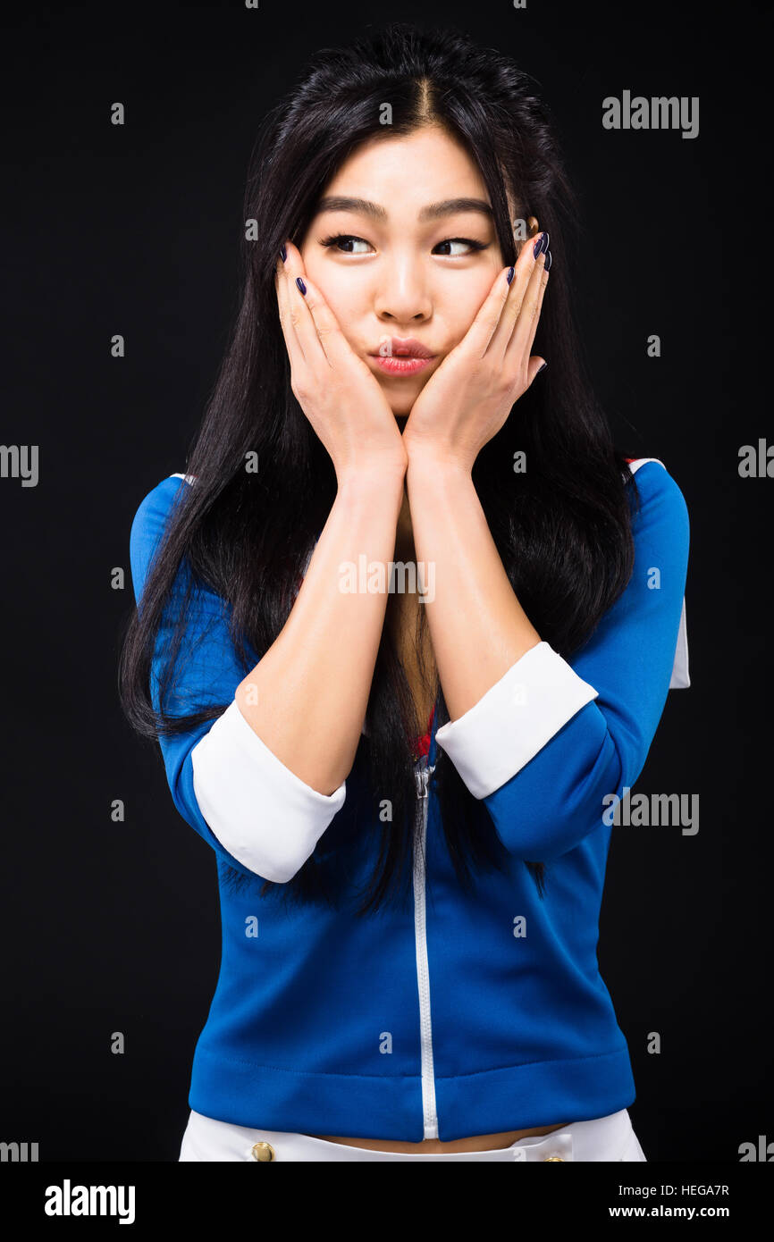 Asian woman expressing emotions in studio Stock Photo - Alamy