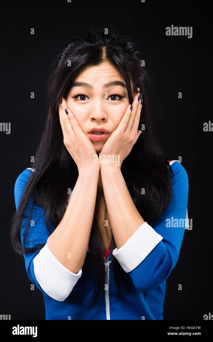 Asian woman expressing emotions in studio Stock Photo - Alamy