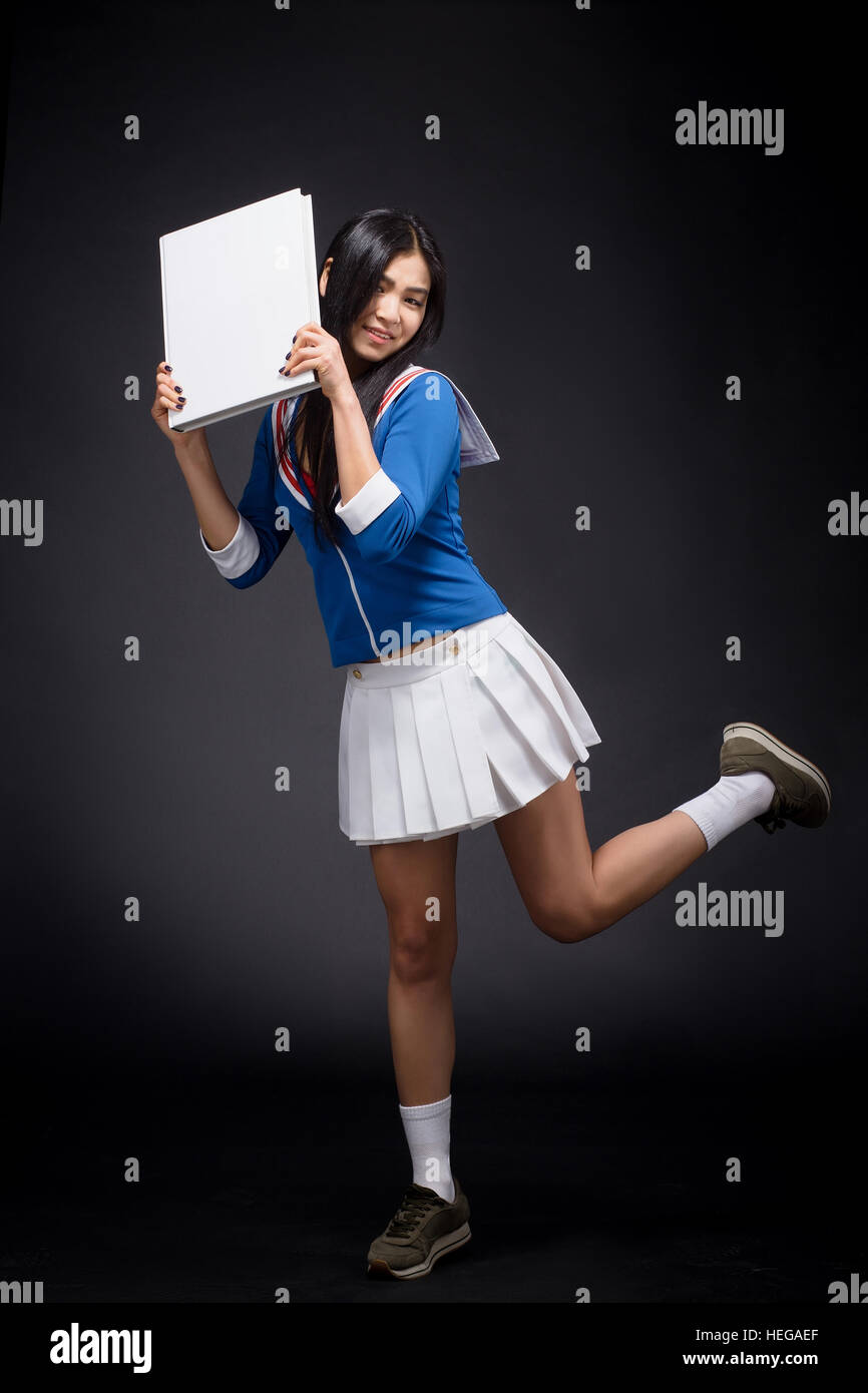 Asian woman posing with blank poster in studio Stock Photo - Alamy