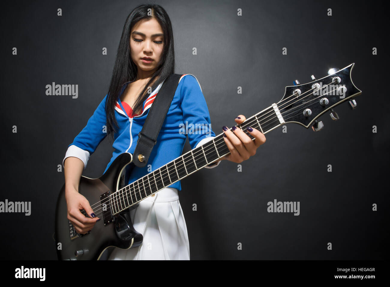 Asian rock star lady in studio Stock Photo - Alamy