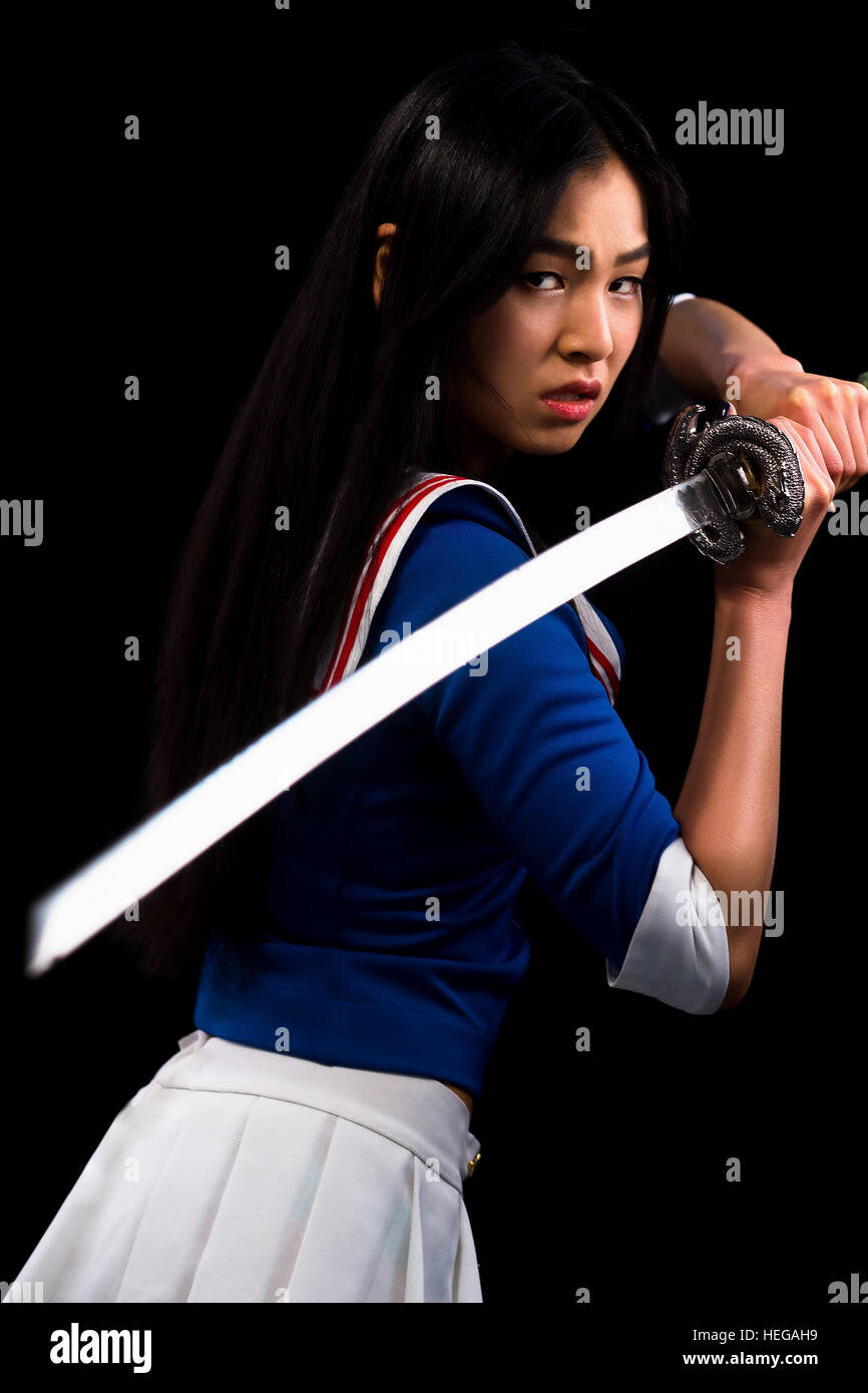 Asian lady with sword in studio Stock Photo - Alamy