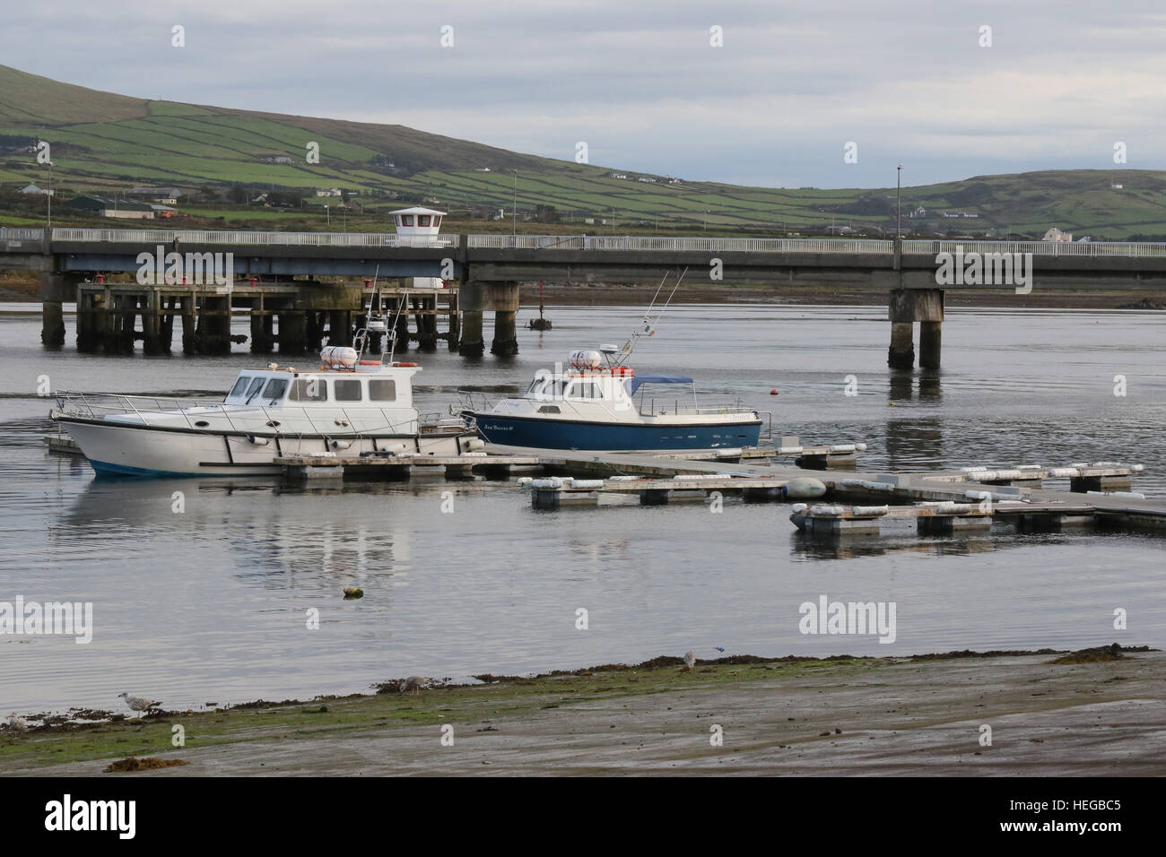 Boats at Portmagee in County Kerry, Ireland. In the background is the ...