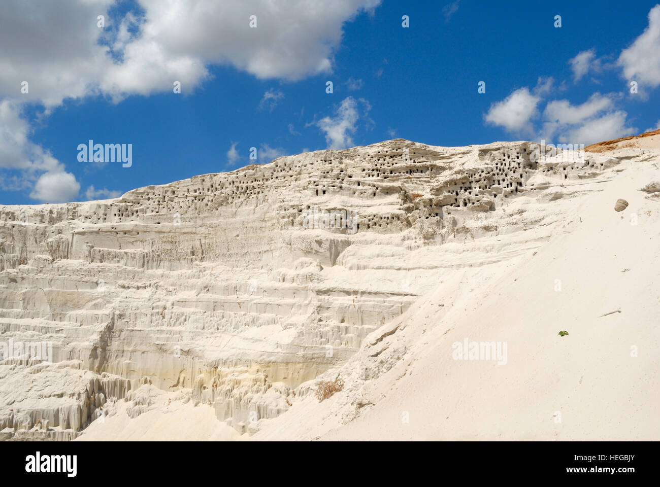 Sandy mountain with the bird's nests against the blue sky Stock Photo ...