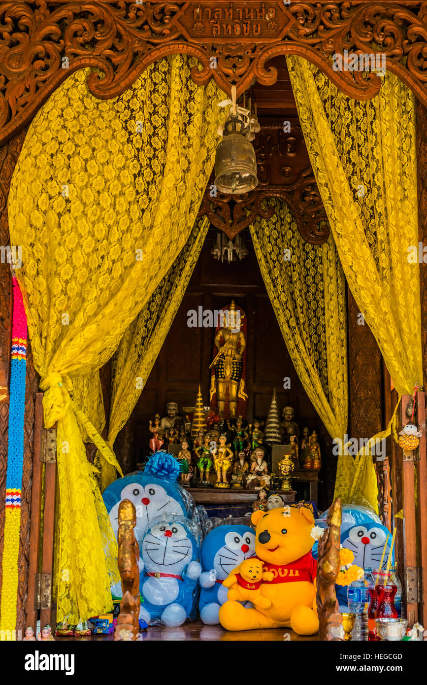 funny altar with toy offerings at Bangkok Thailand Stock Photo - Alamy