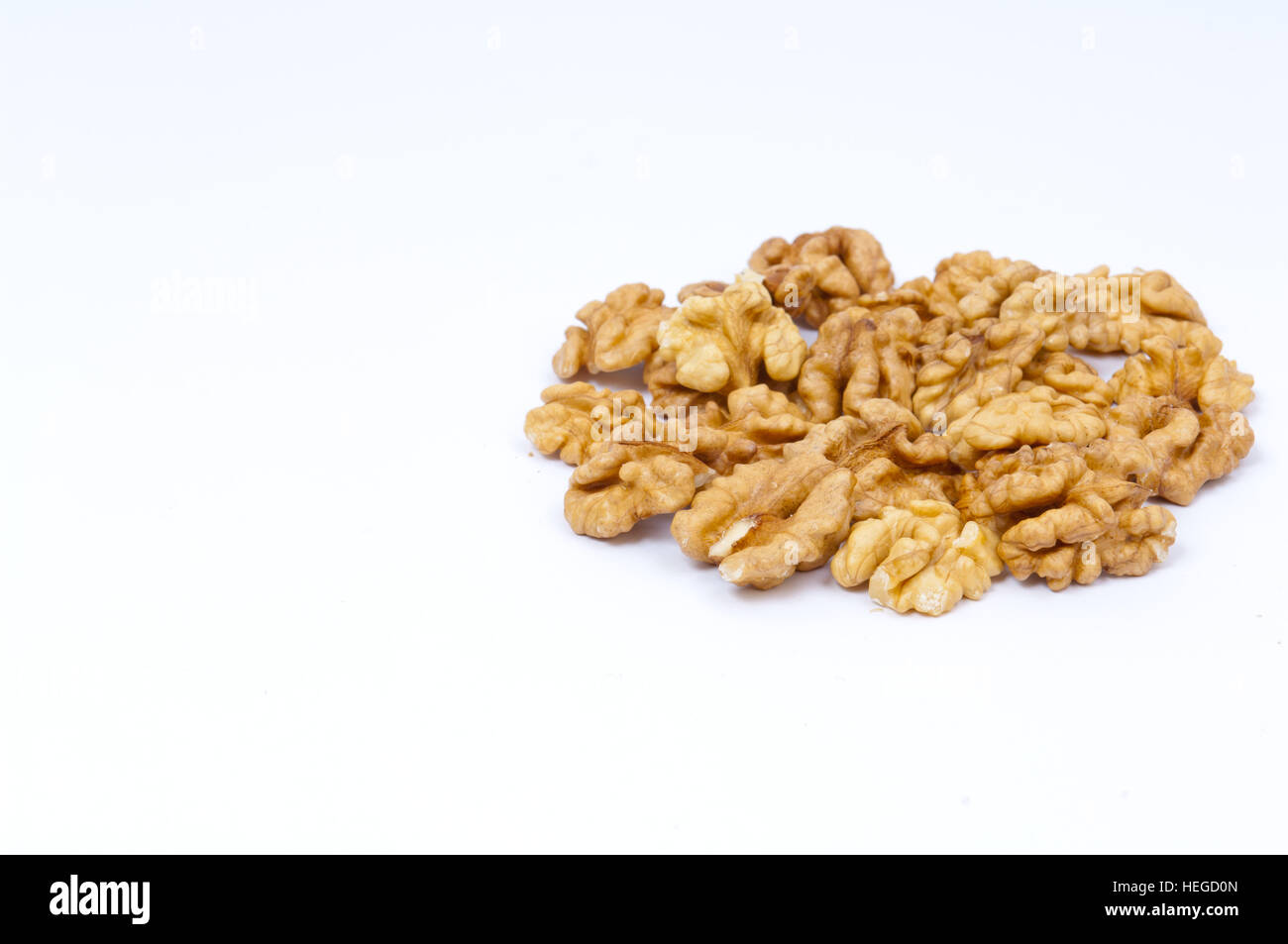 Whole walnuts and walnut kernels on white background Stock Photo - Alamy