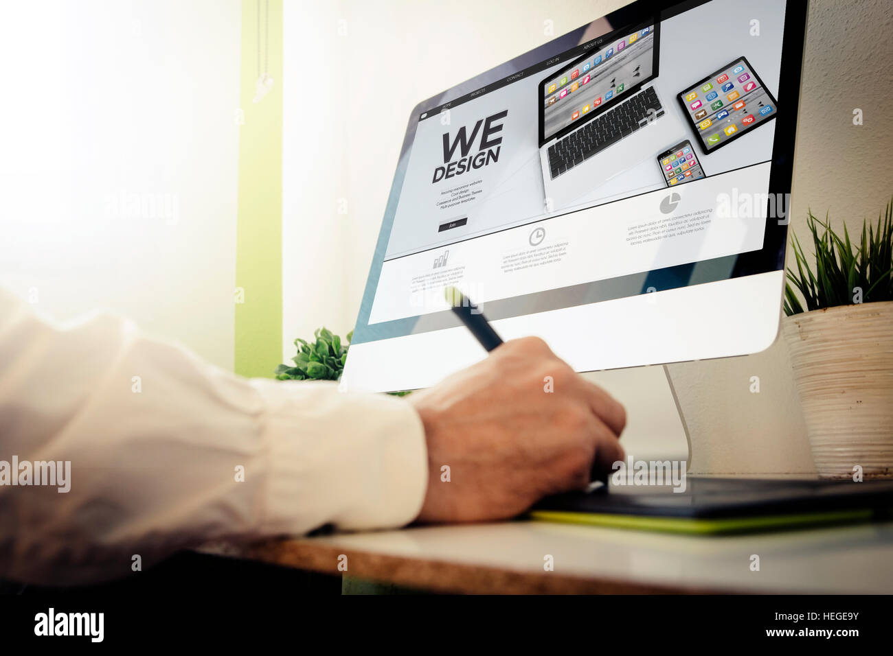 web developer designing a responsive website. All screen graphics are ...