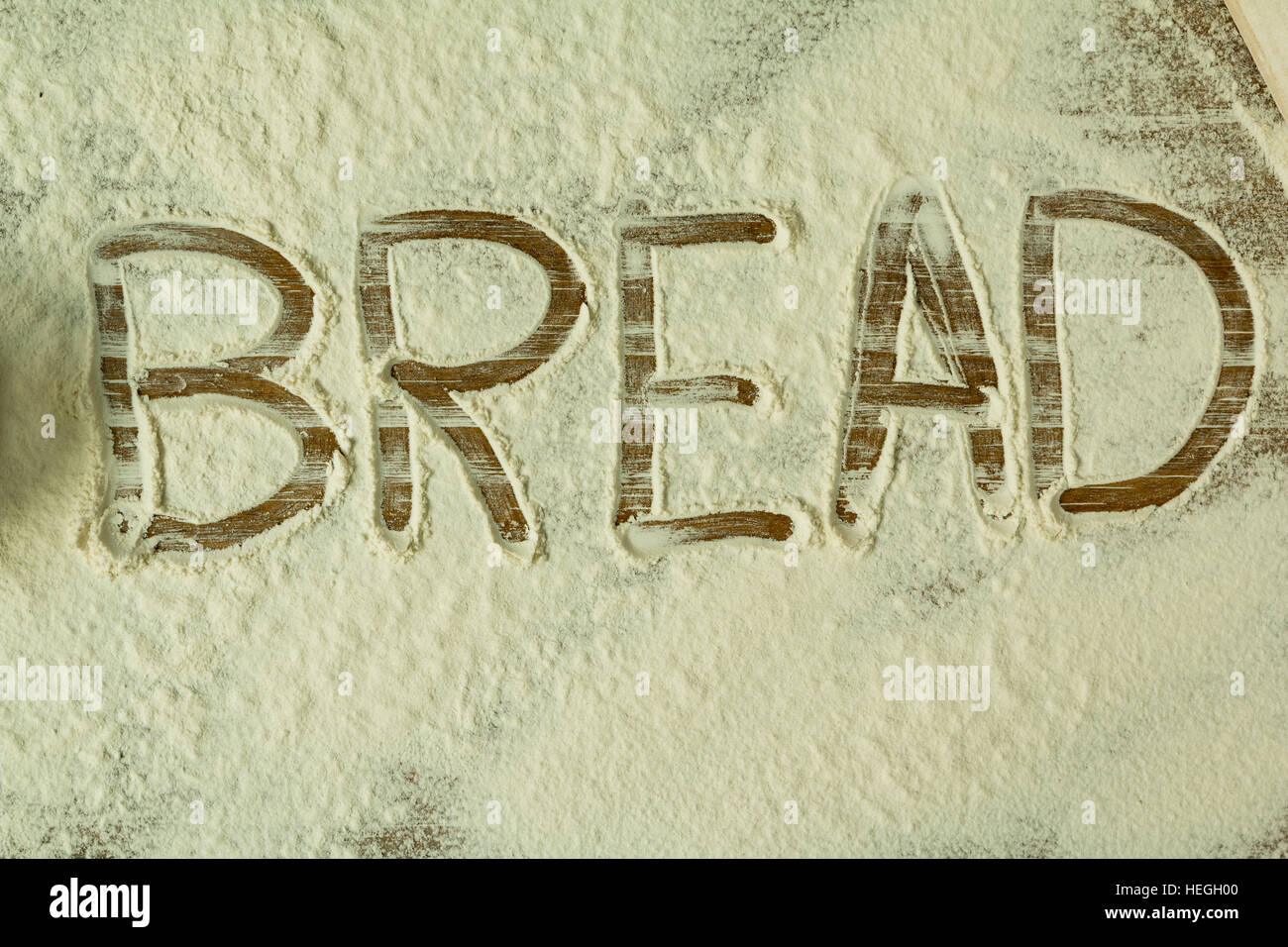 Flour on the table with writted word BREAD Stock Photo - Alamy