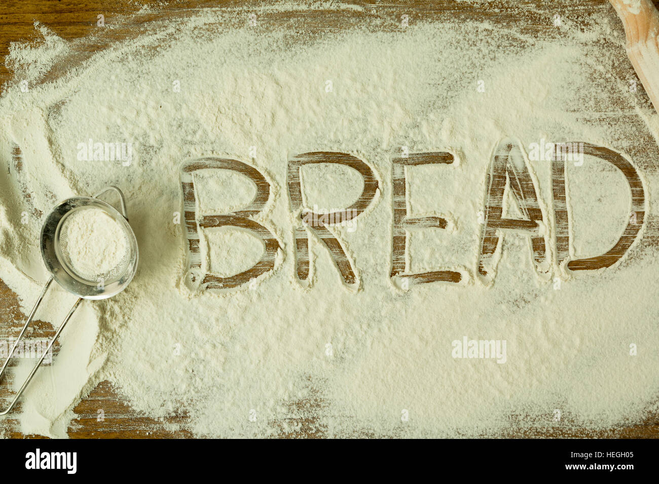 Flour on wooden table word bake hi-res stock photography and images - Alamy