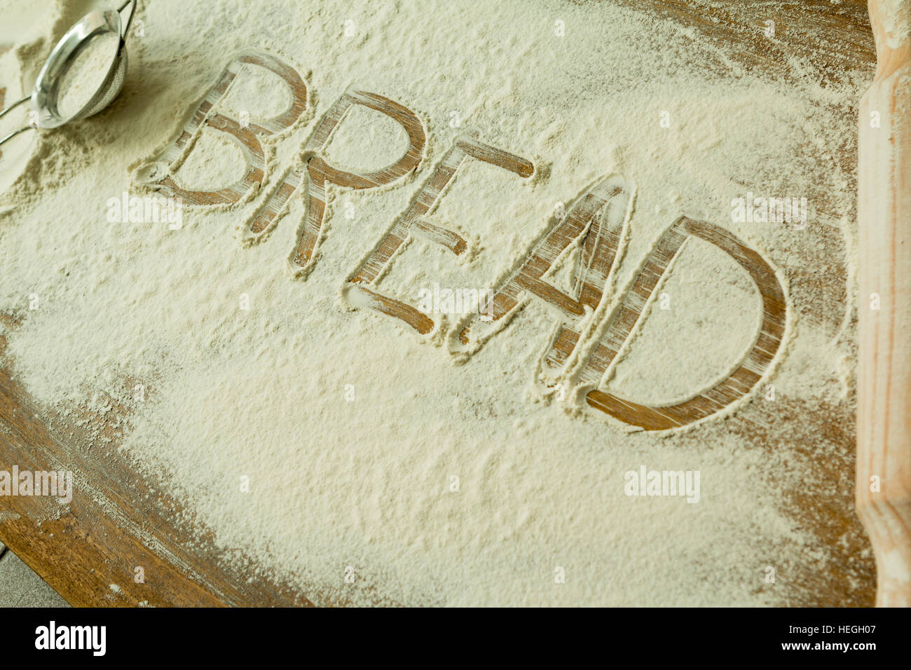 Flour on the table with writted word BREAD Stock Photo - Alamy