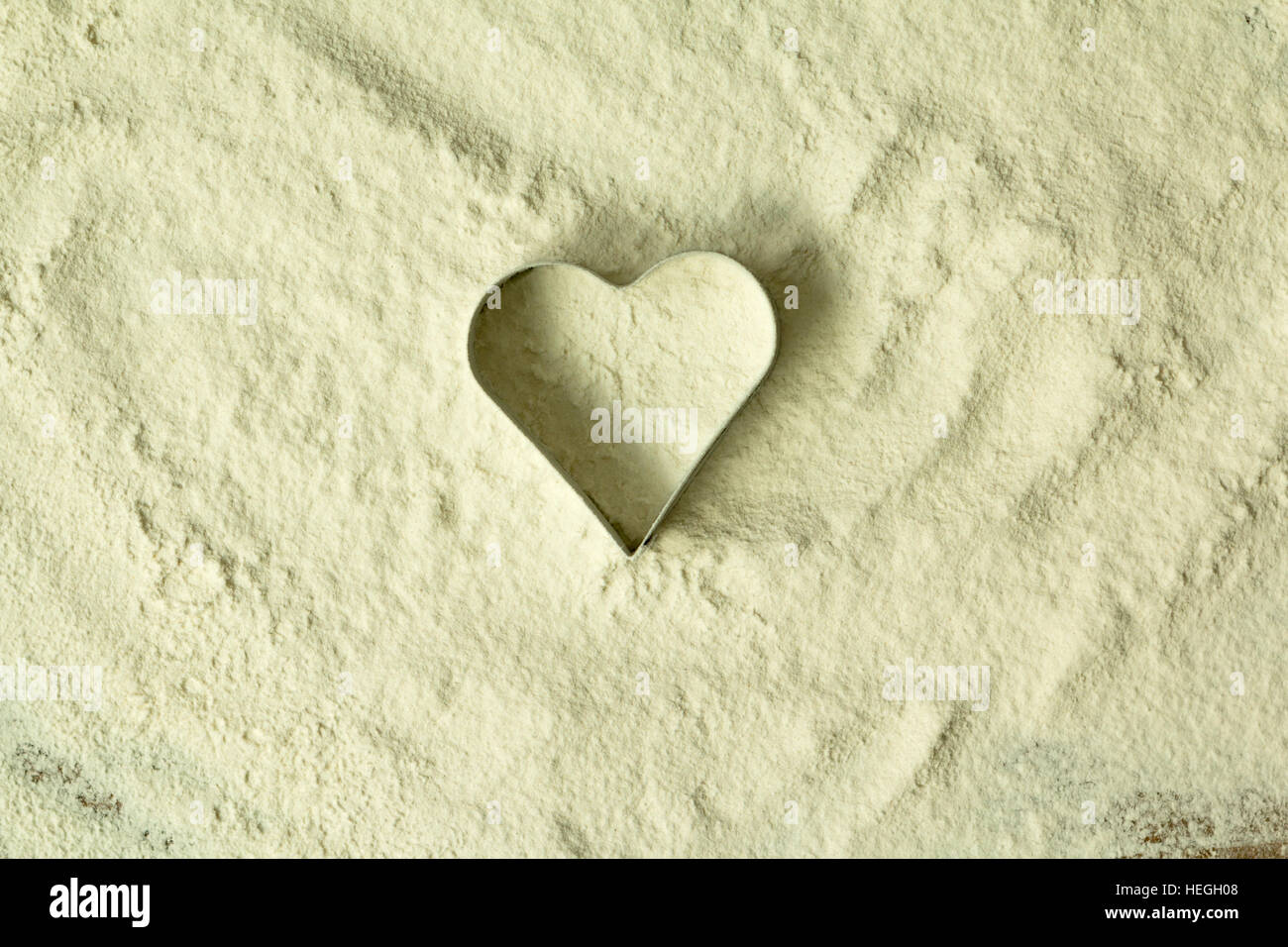 Heart shape in flour on baking board hi-res stock photography and ...