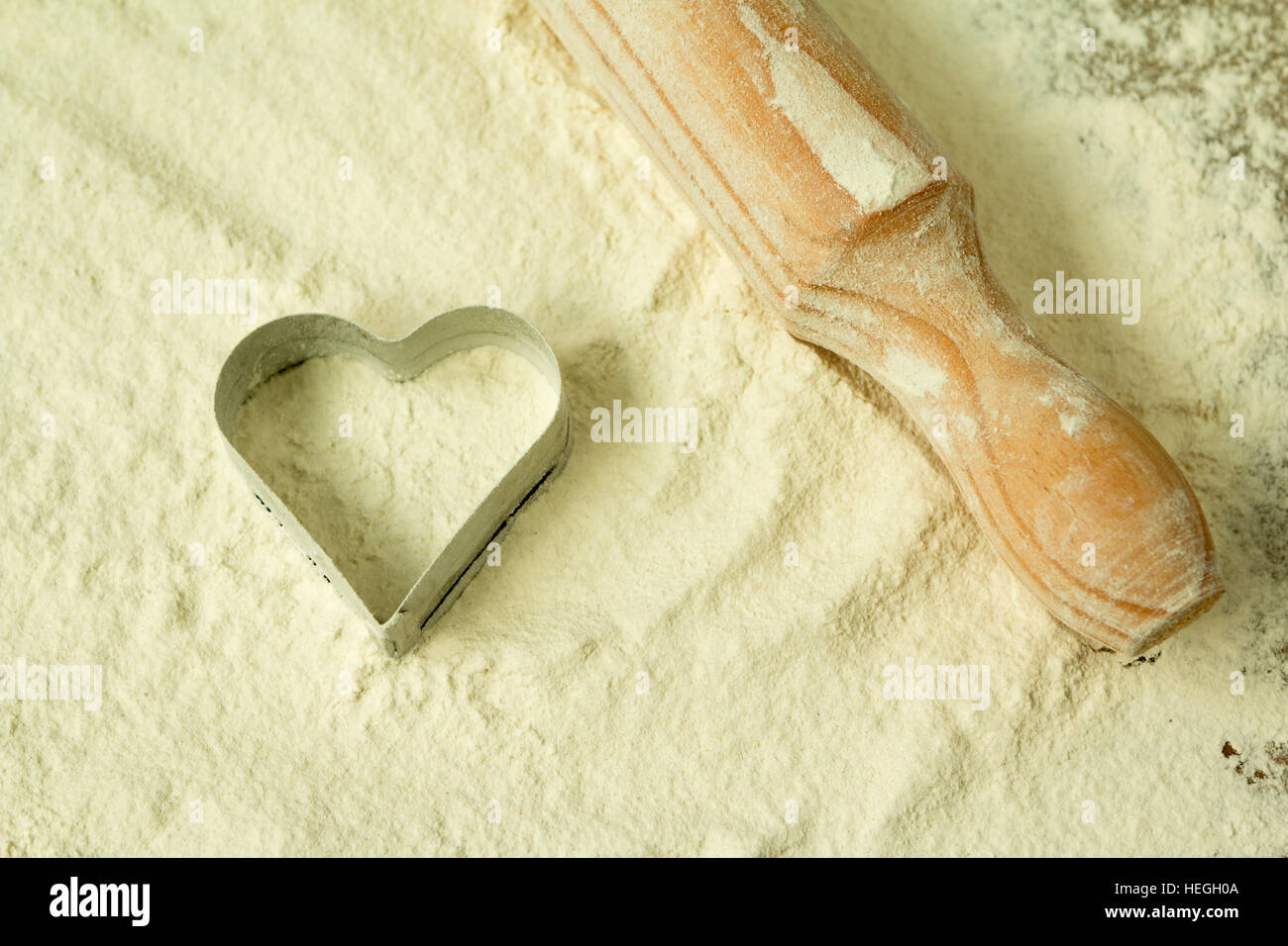 Heart shape in flour on board hi-res stock photography and images - Alamy