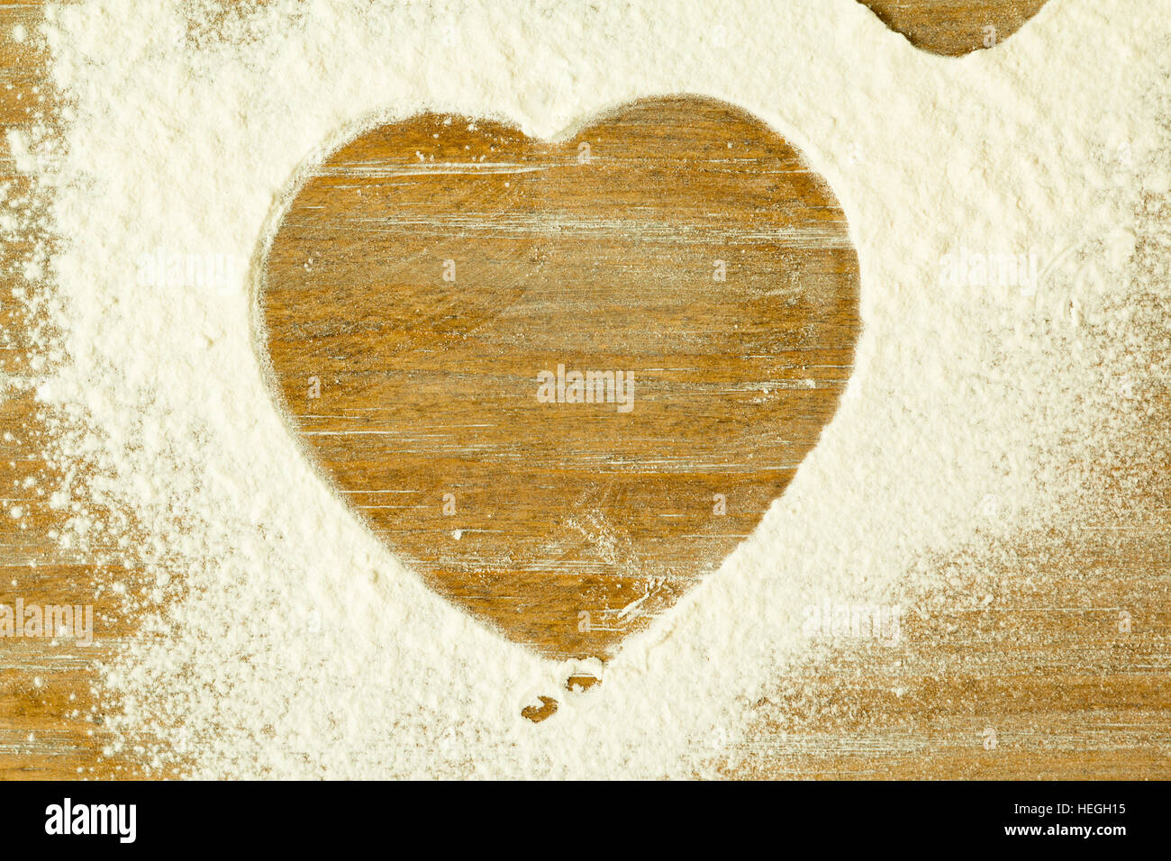 Heart shape in flour on baking board hi-res stock photography and ...